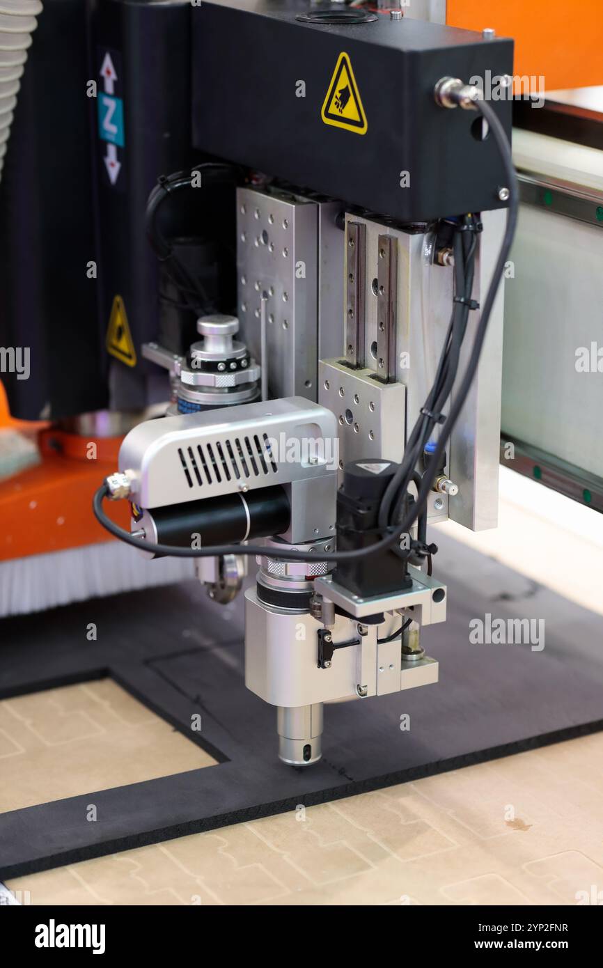 Rubber cutting with CNC digital cutting machine. Closeup of automatic ...