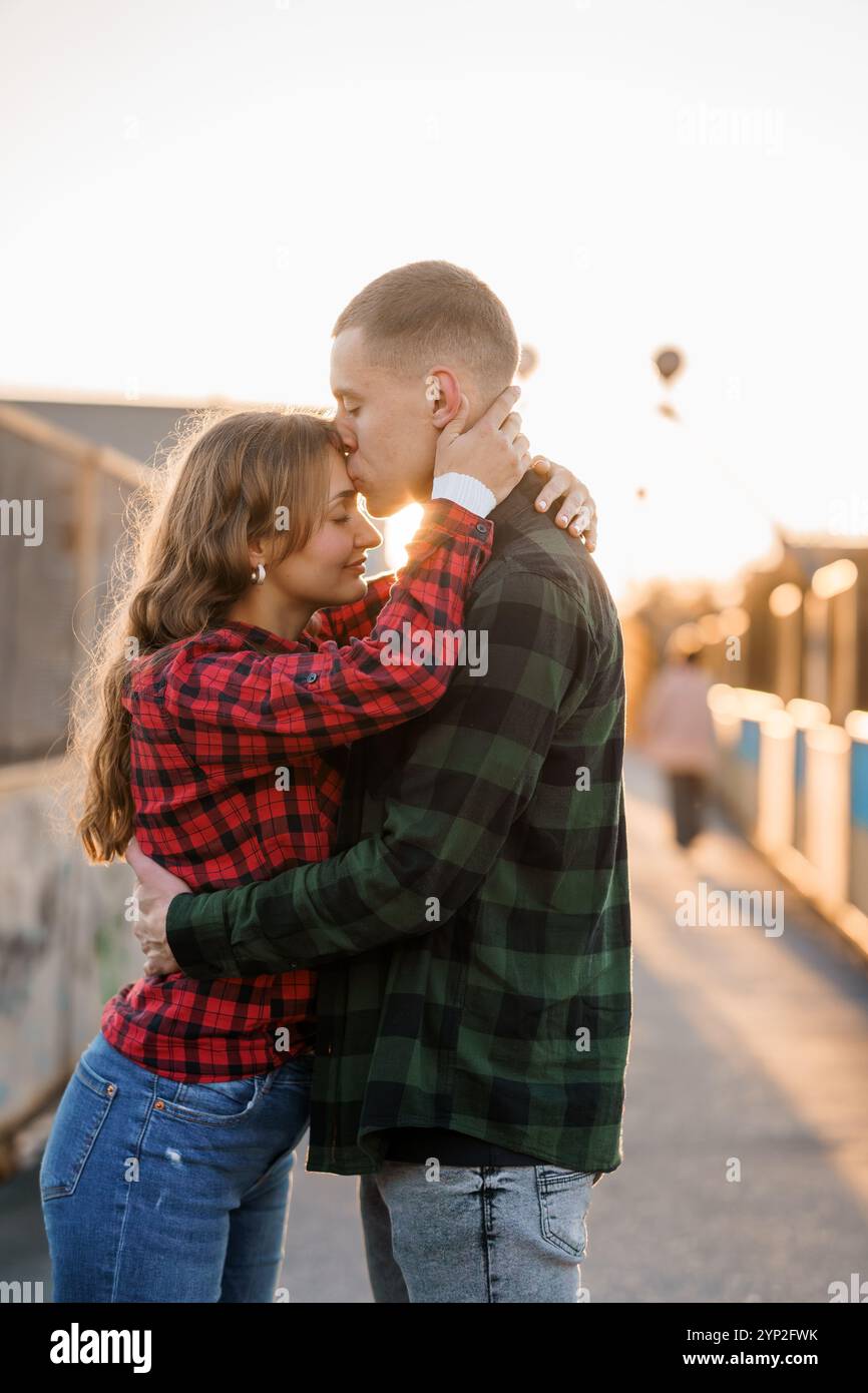 Intimate Sunset Embrace of a Joyful Couple in Cozy Flannel Shirts Stock ...