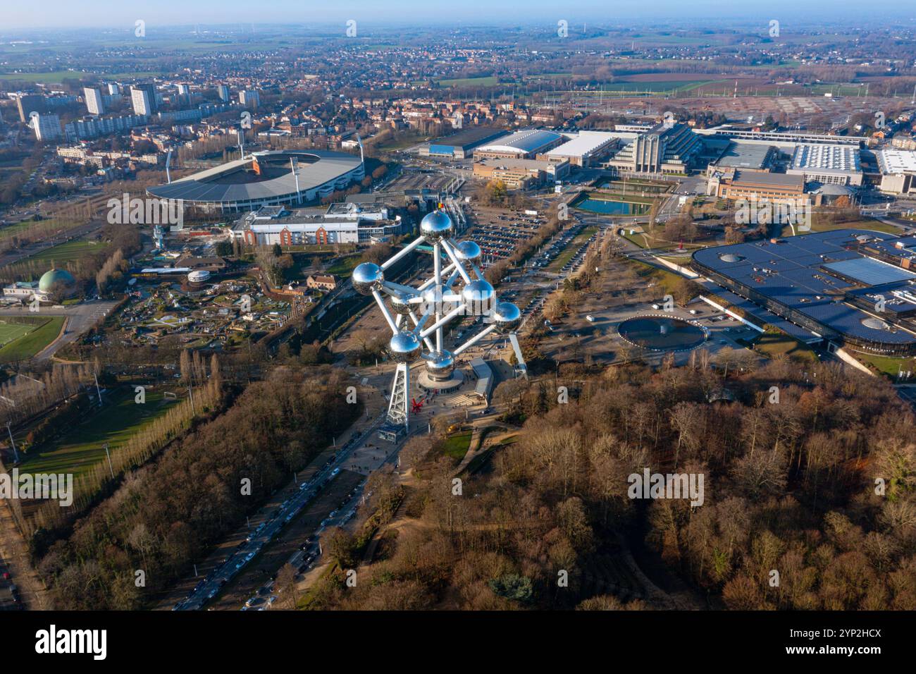 Aerial view of the Atomium in Brussels surrounded by lush greenery ...