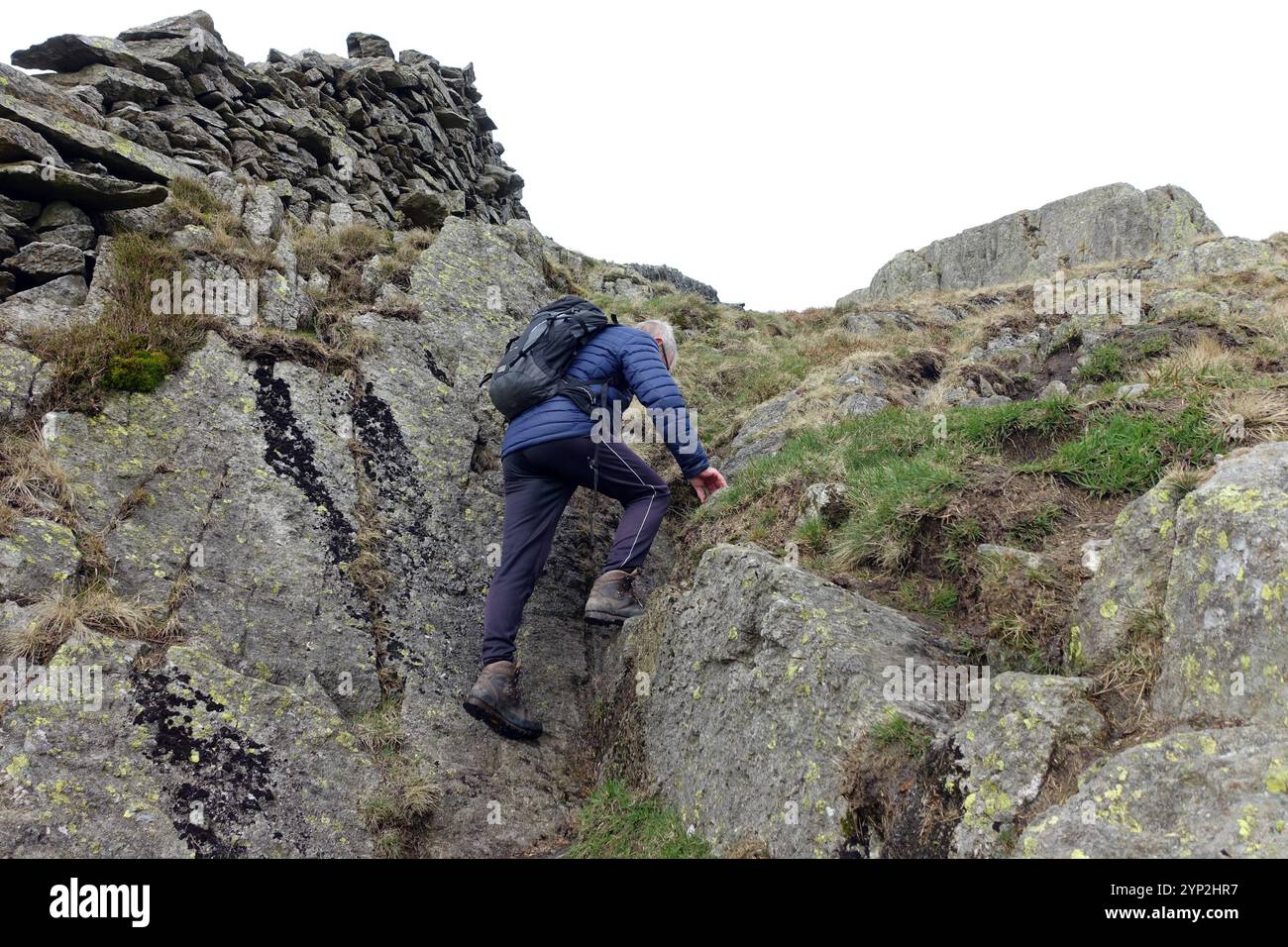 Lone Man (Hiker) Scrambling up Rock Crag to the Wainwright 'Low Pike ...