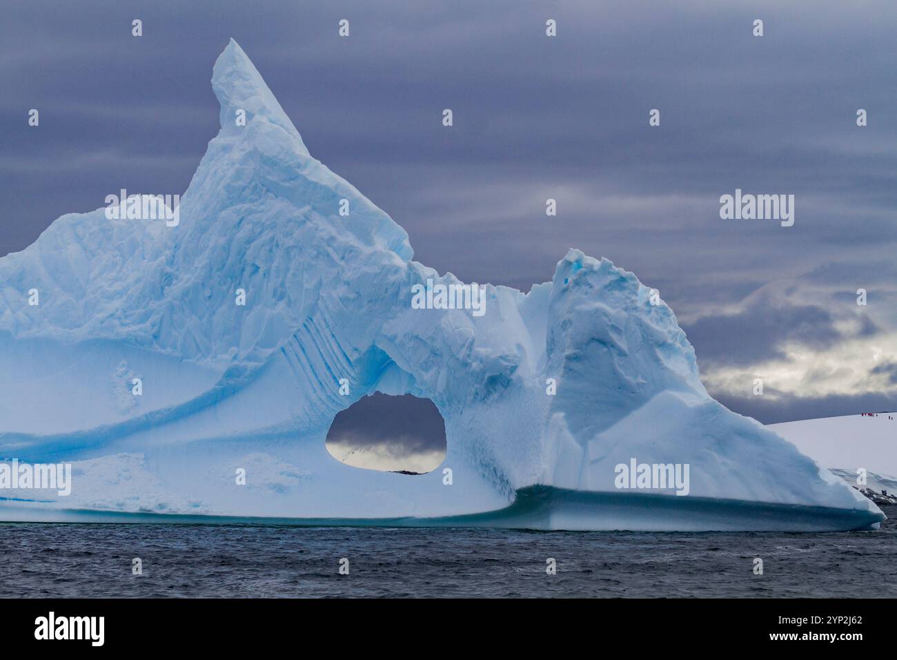 Unusual window formation in iceberg showing Booth Island in the ...