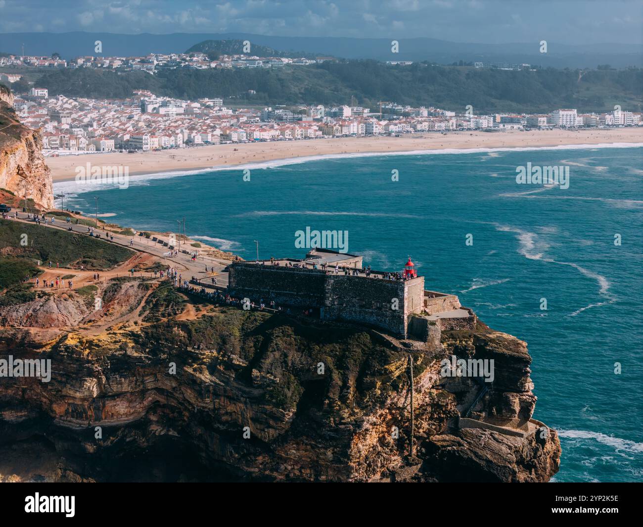 Aerial view of tourists at the historic Sao Miguel Arcanjo lighthouse ...