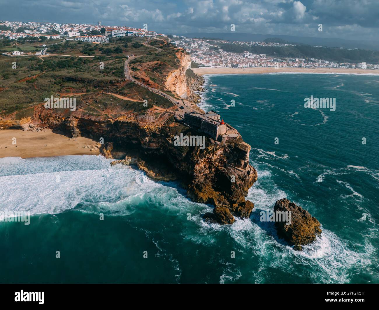 Aerial view of tourists at the historic Sao Miguel Arcanjo lighthouse ...