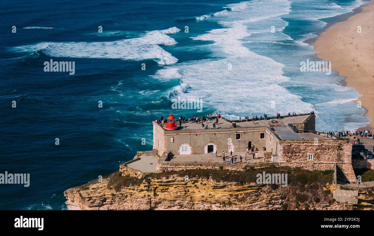 Aerial view of tourists at the historic Sao Miguel Arcanjo lighthouse ...