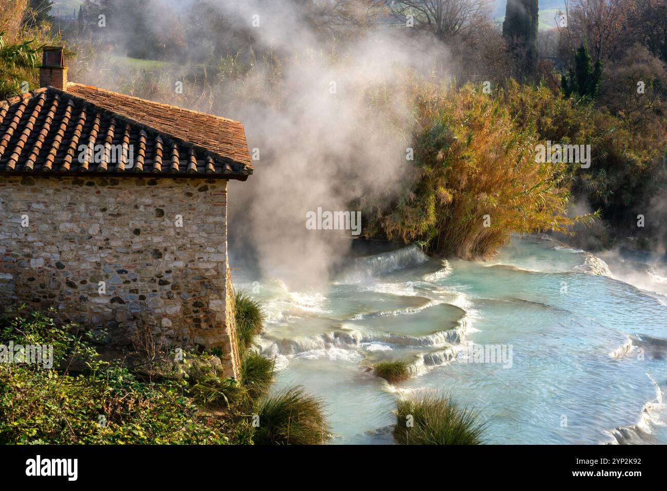 Saturnia hot springs with turquoise water and an old mill, Saturnia ...