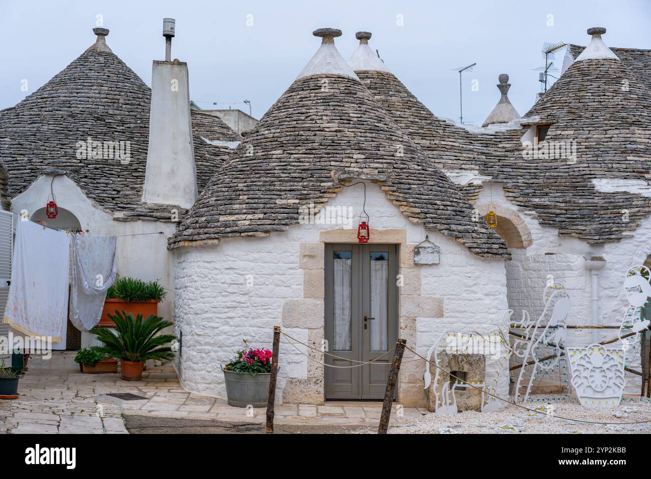 Alberobello iconic old Trullo and Trulli white houses with stone ...