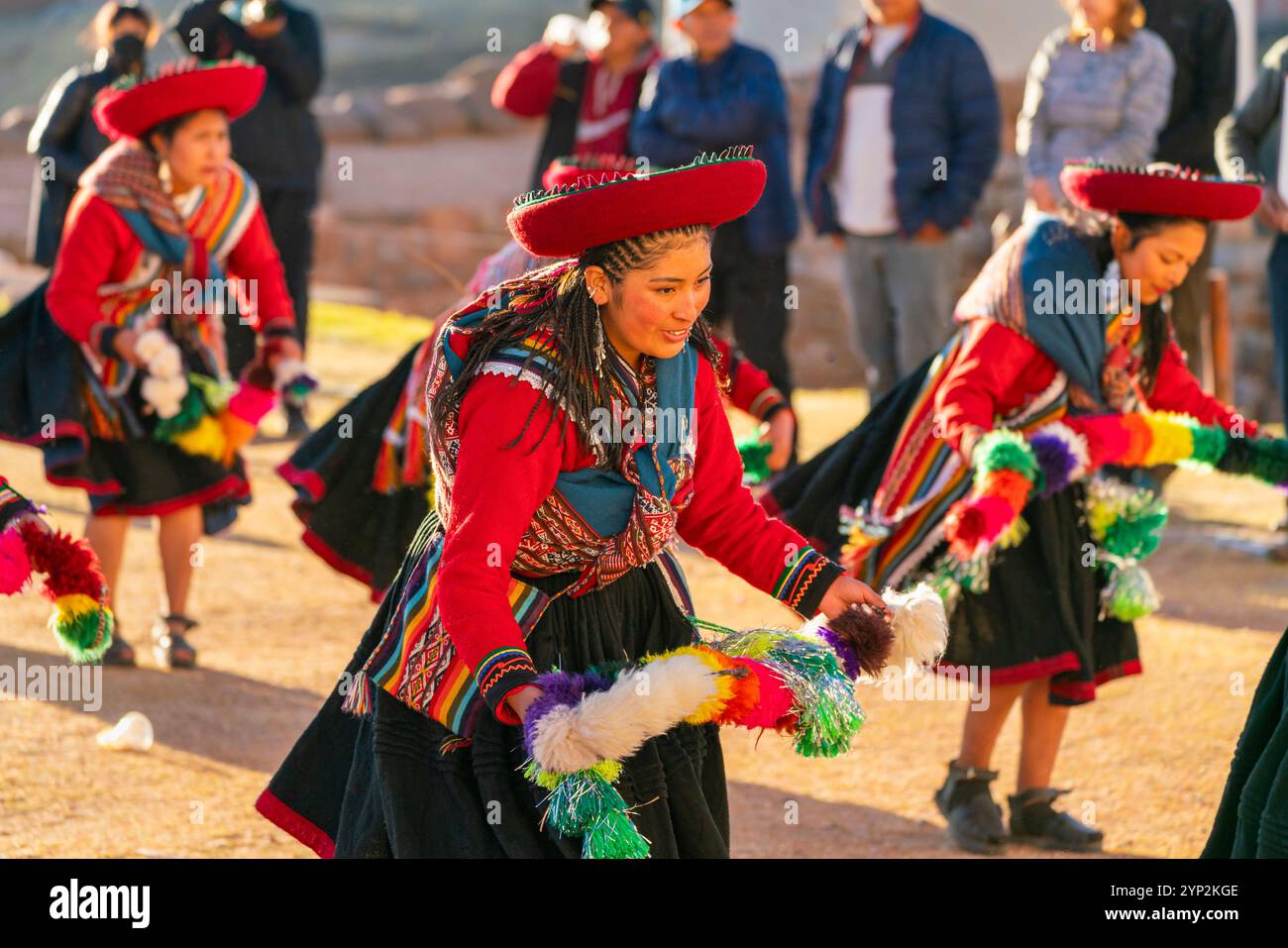 Peruvian women in traditional dresses dancing on celebration, Chinchero ...