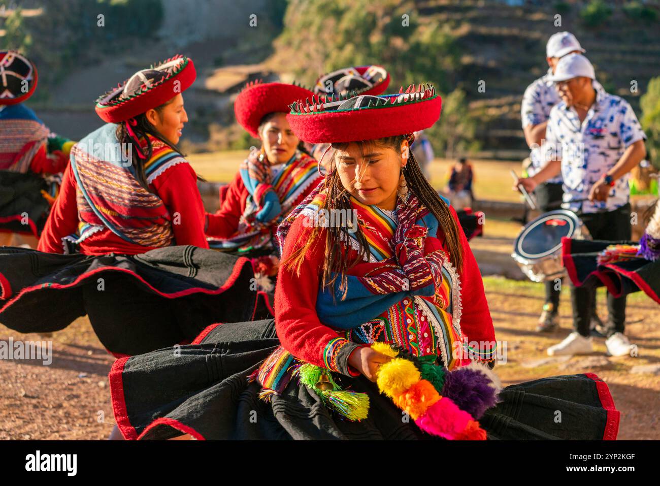 Peruvian women in traditional dresses dancing on celebration, Chinchero ...