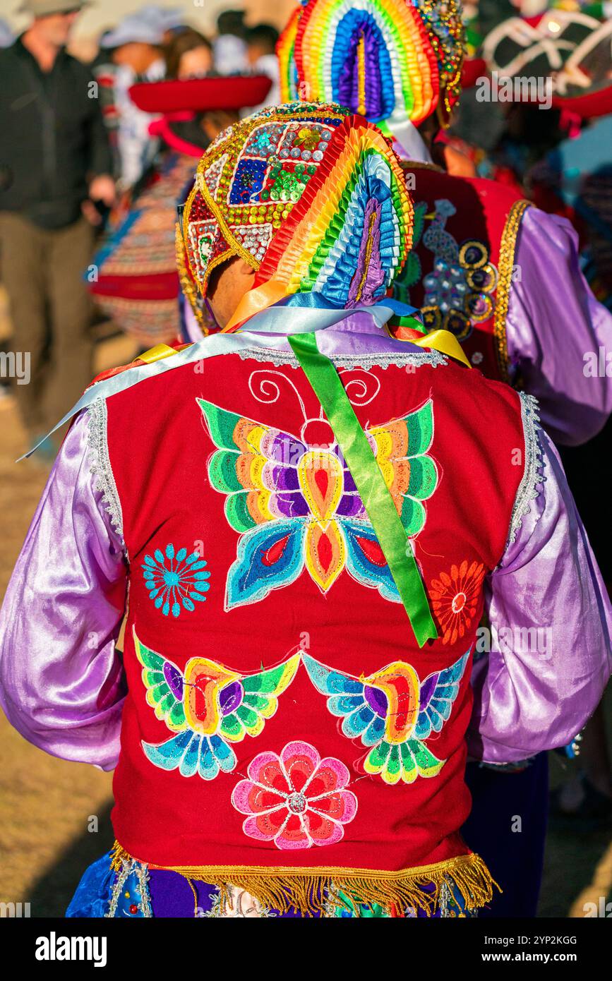 Back view of Peruvian man in traditional dress on celebration ...