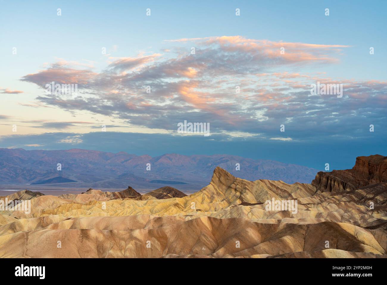 Natural rock formations with Manly Beacon at Zabriskie Point at sunrise ...