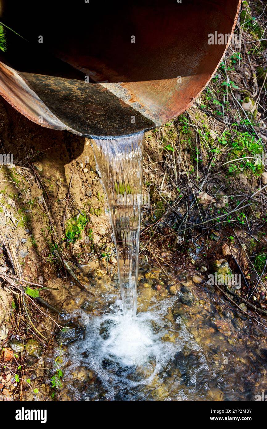 Water falling into a stream from a culvert Stock Photo - Alamy