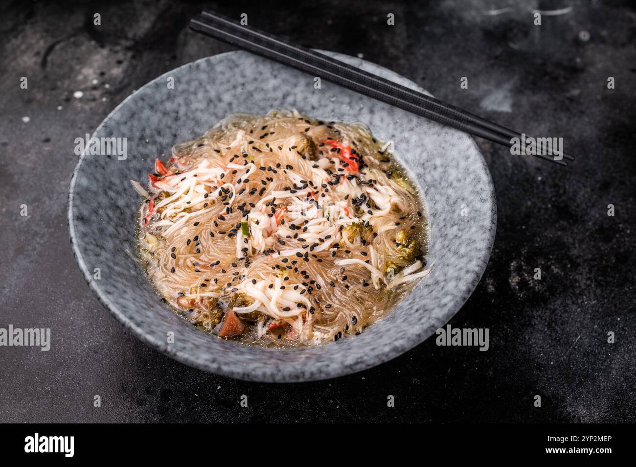 Wok with glass noodles, spicy peanut dressing, meat and vegetables ...