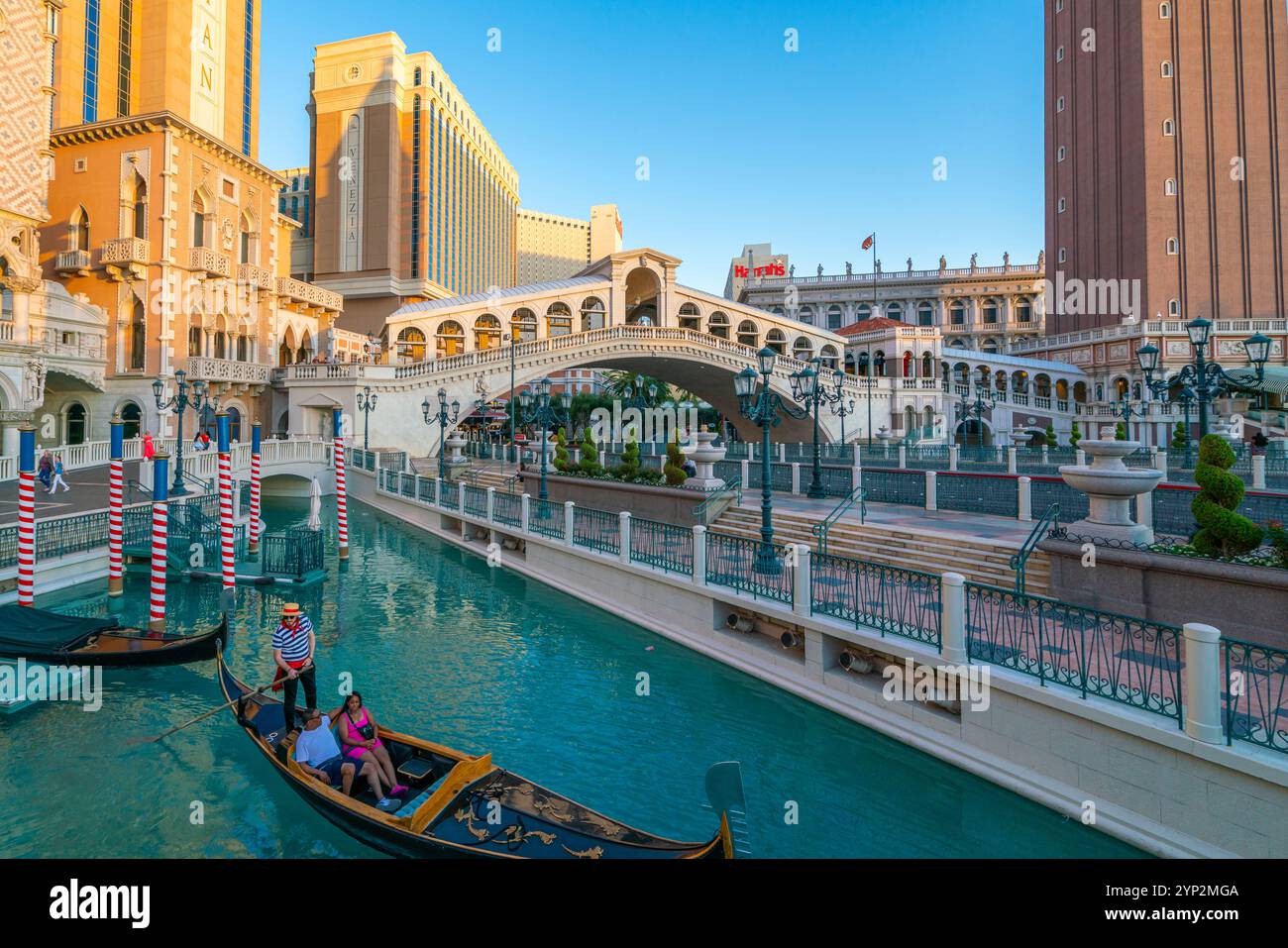 Gondola rides in canal The Venetian Las Vegas Hotel at sunset, Las Vegas Strip, Paradise, Las ...