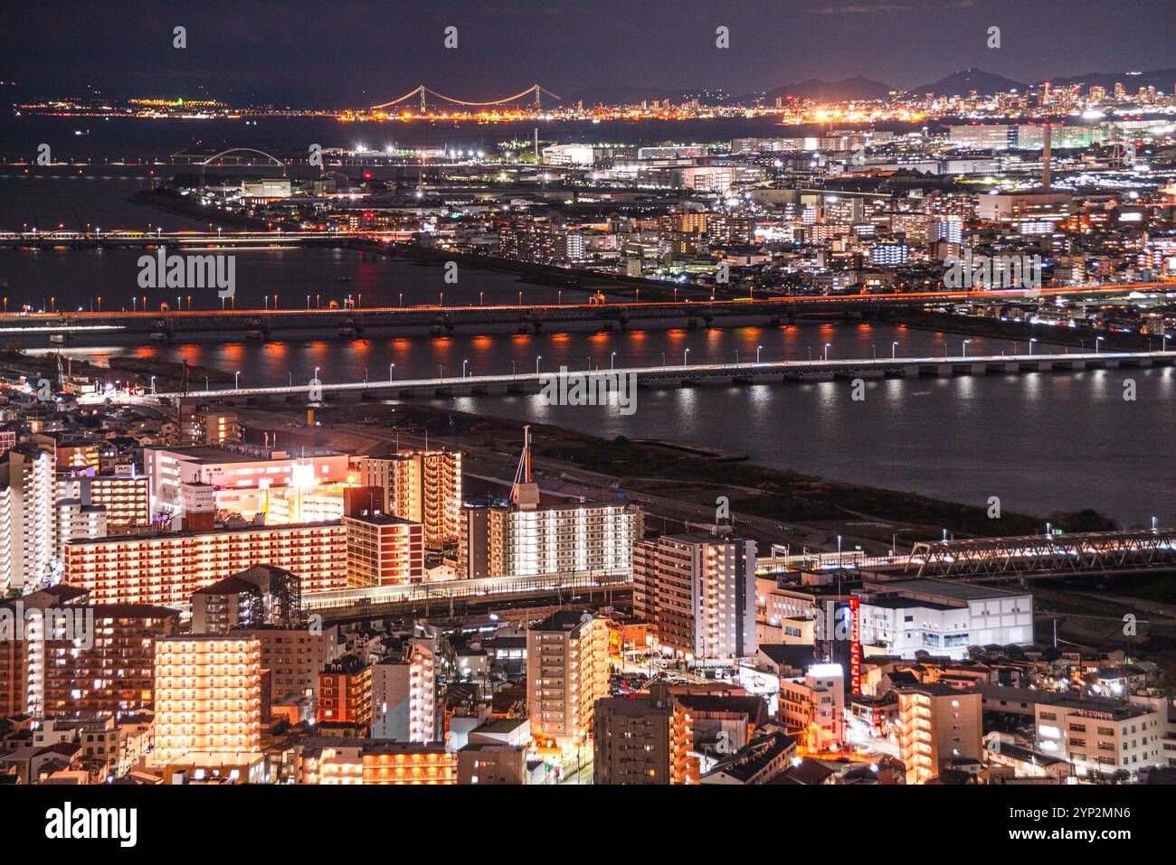 Highway and railway bridges crossing the Yodo River, night skyline ...