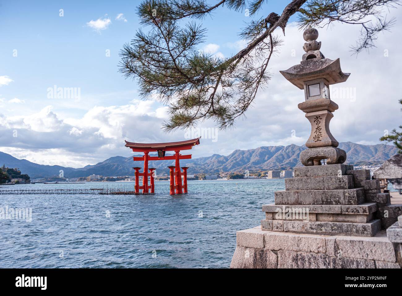 Zen stone lanterns and the landmark Otori gate, Torii Gate of Miyajima ...