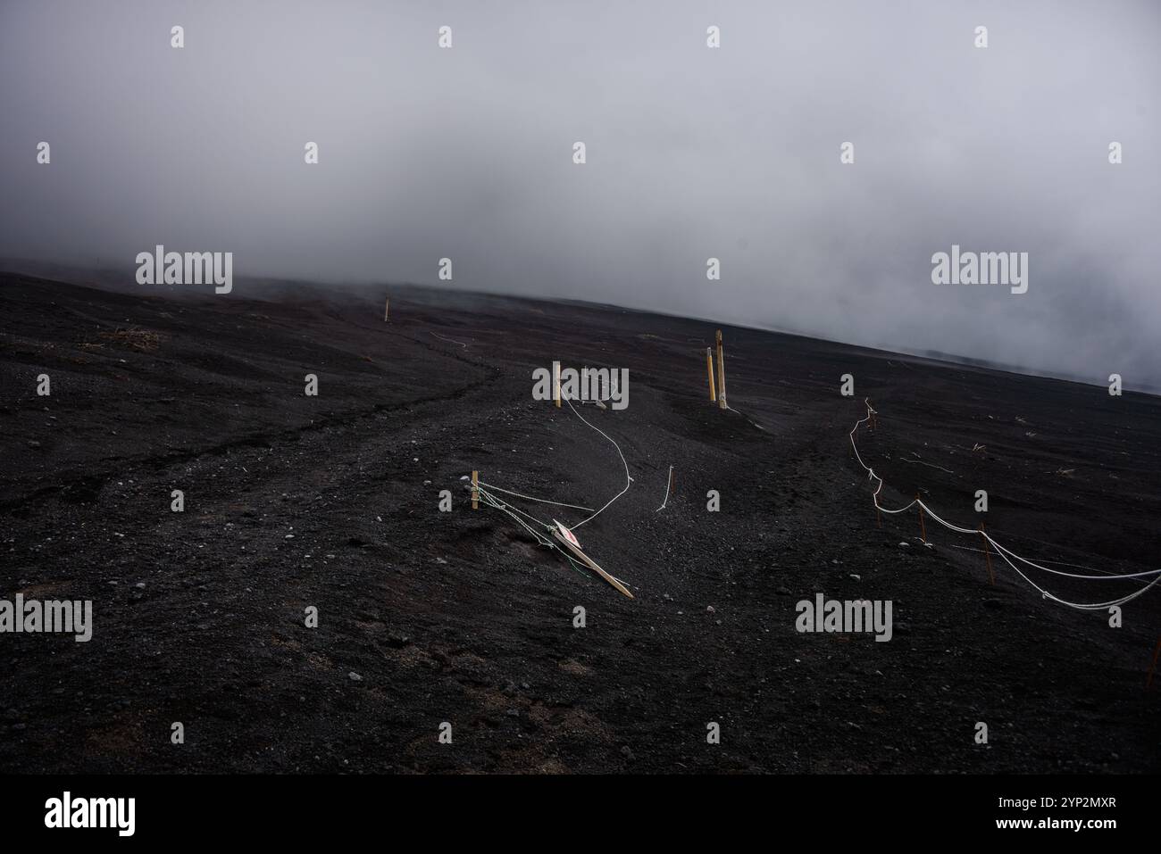 Hiking path in the ashes of Mount Fuji in a fog cloud, Honshu, Japan ...