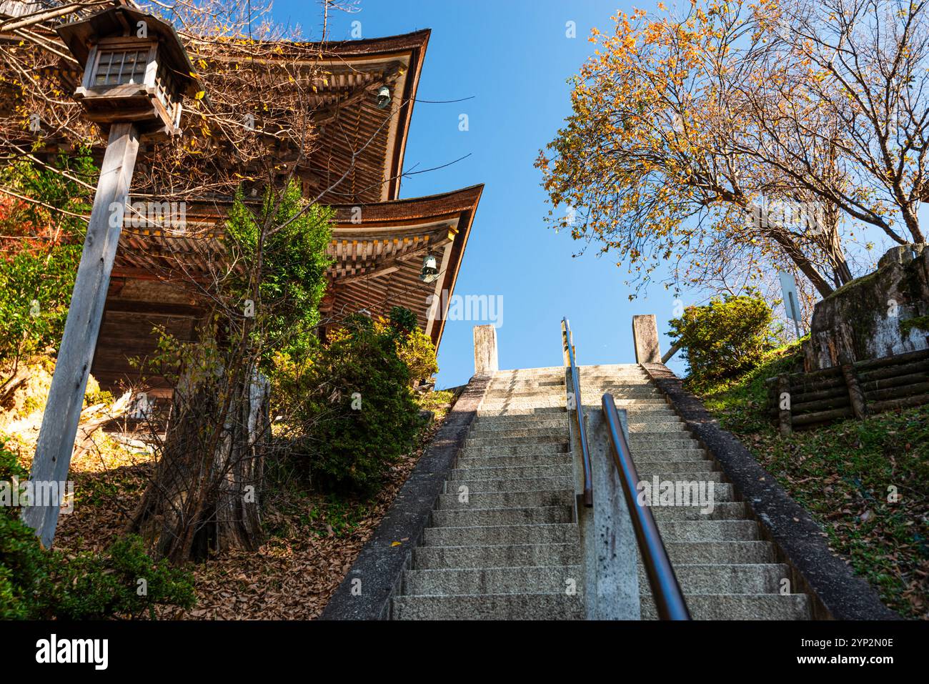 Stairs by a lantern leading up to a temple roof in autumn, Yoshino Yama ...