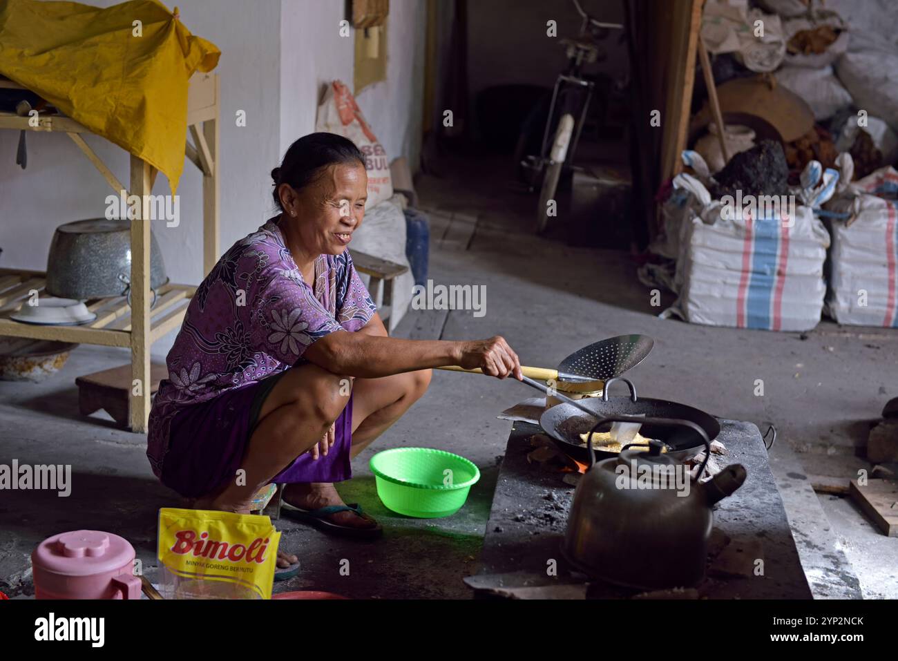 Woman cooking at Kidang Mas Batik House, Lasem, Java island, Indonesia ...