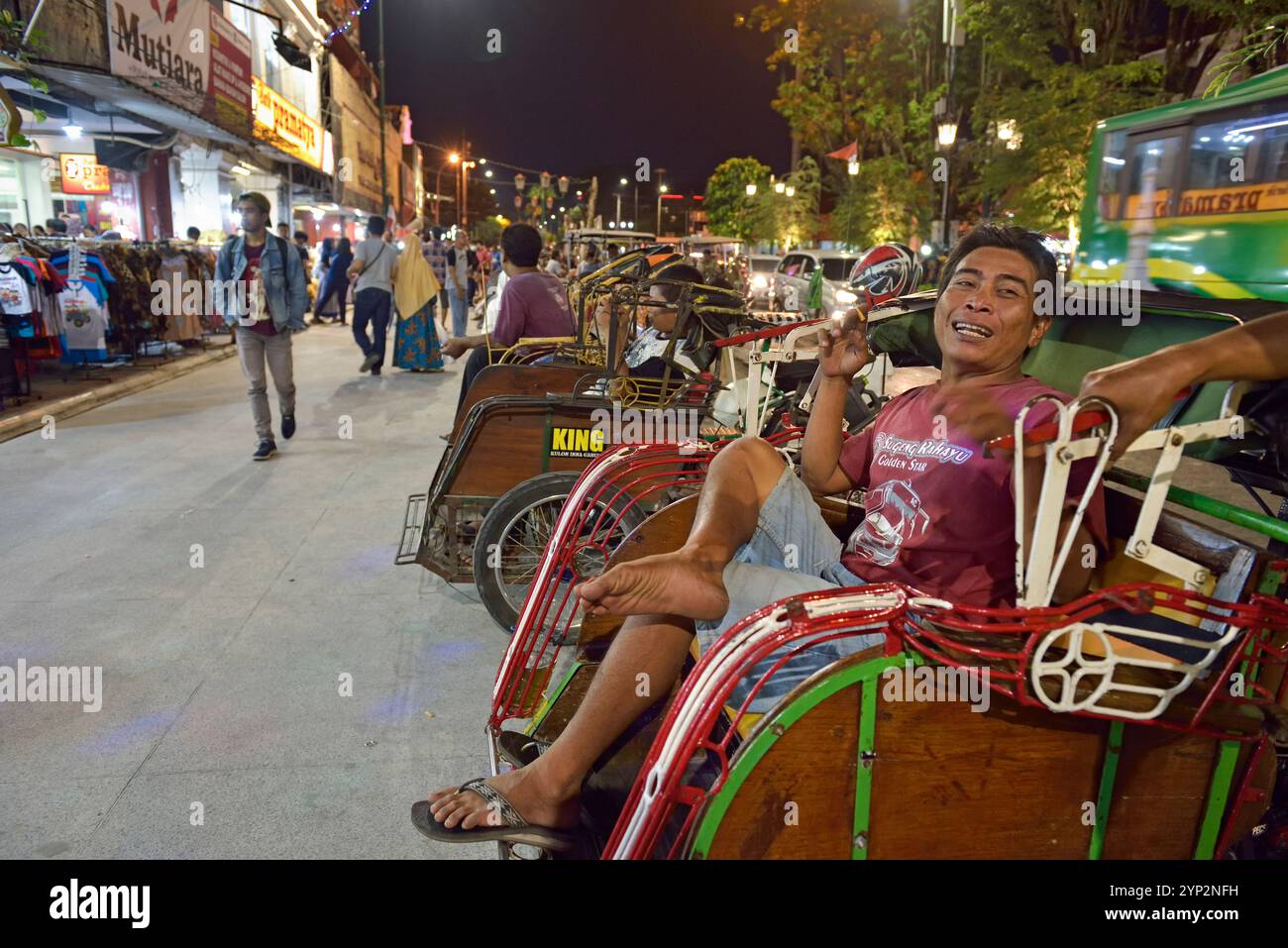 Cycle rickshaw (becak) driver in Malioboro Street, major shopping ...