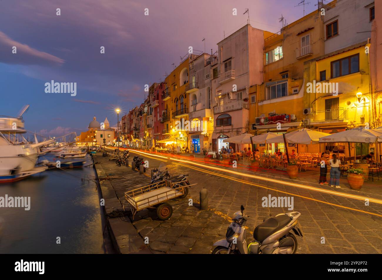 View of shops and restaurants in the fishing port Marina Grande with ...