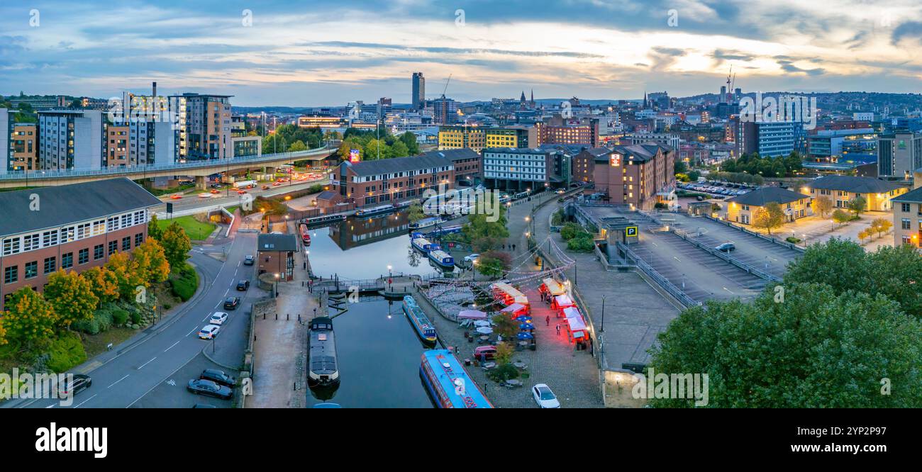 Aerial view of Victoria Quays and Sheffield city skyline at dusk ...