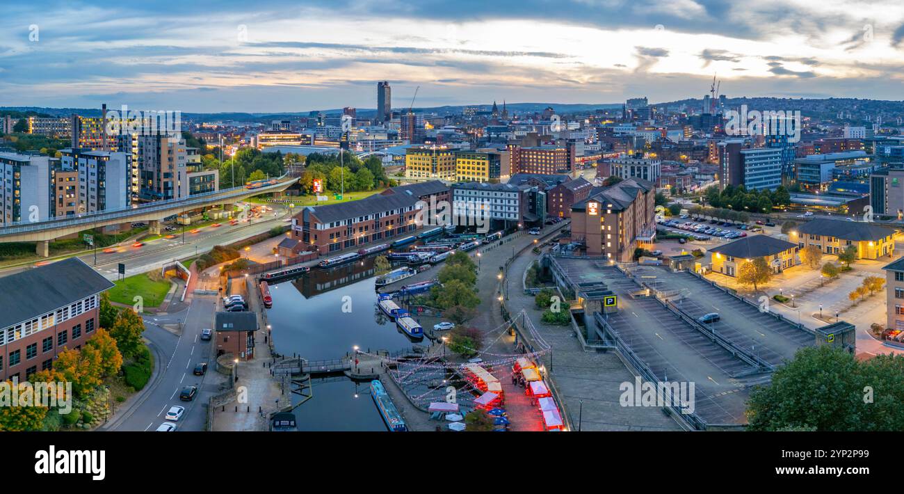 Aerial view of Victoria Quays and Sheffield city skyline at dusk ...