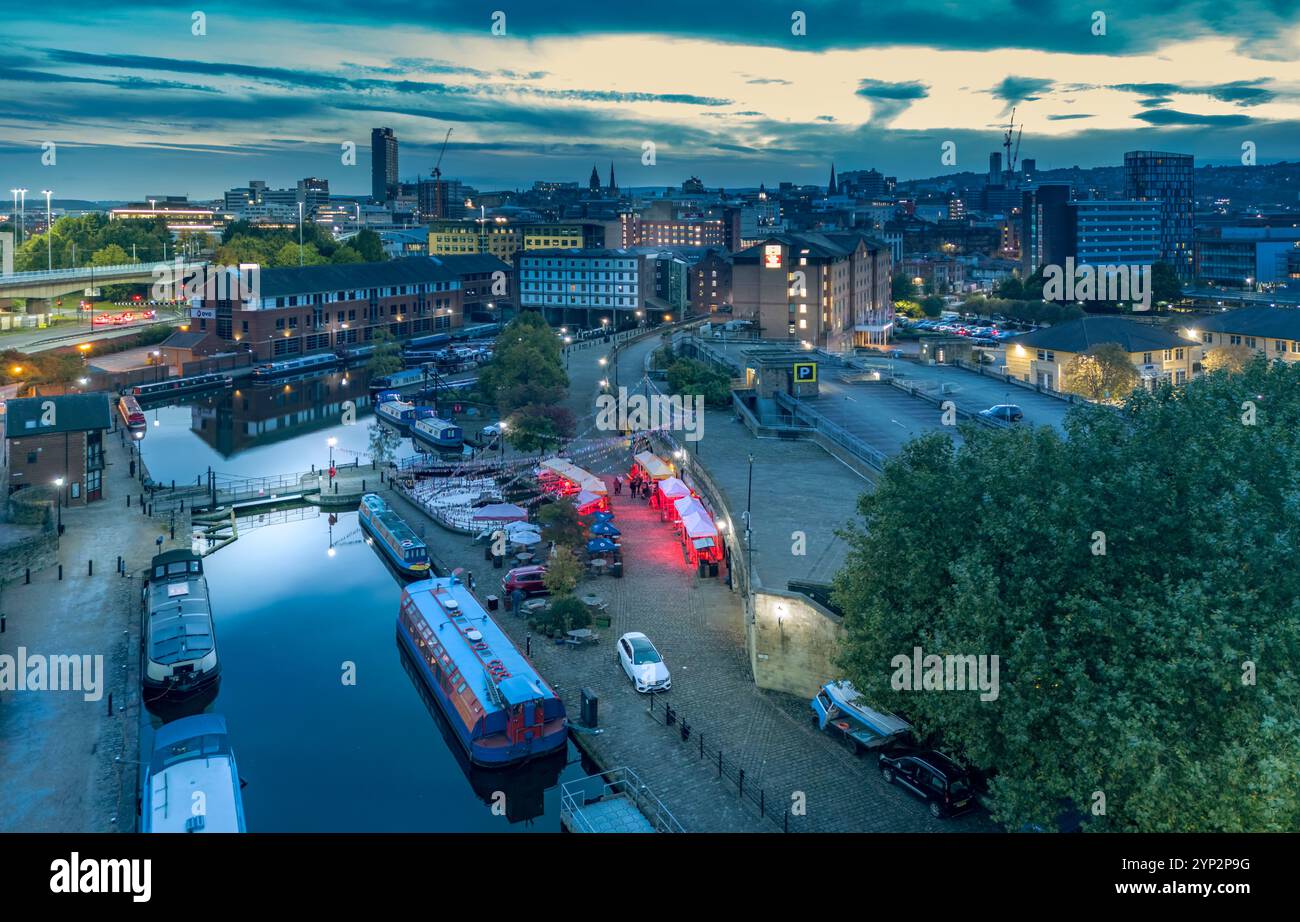Aerial view of Victoria Quays and Sheffield city skyline at dusk ...
