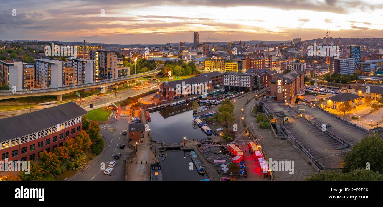 Aerial view of Victoria Quays and Sheffield city skyline at dusk ...