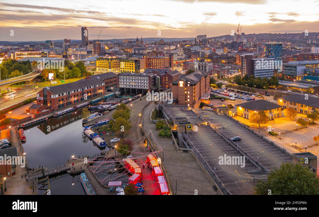 Aerial view of Victoria Quays and Sheffield city skyline at dusk ...