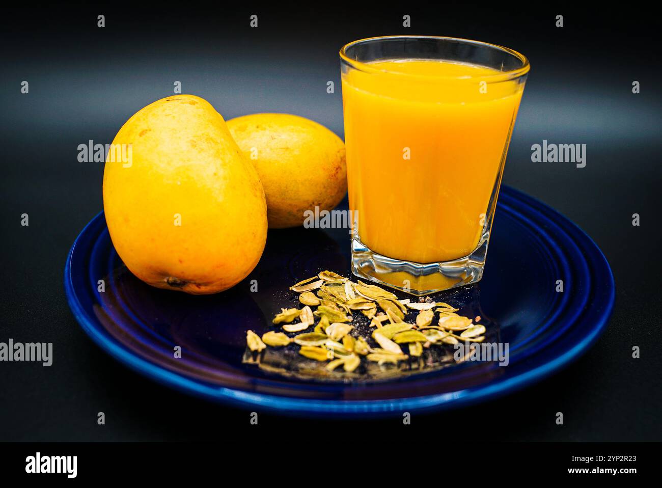 A Glass of Mango Lassi with Cardamom Stock Photo - Alamy