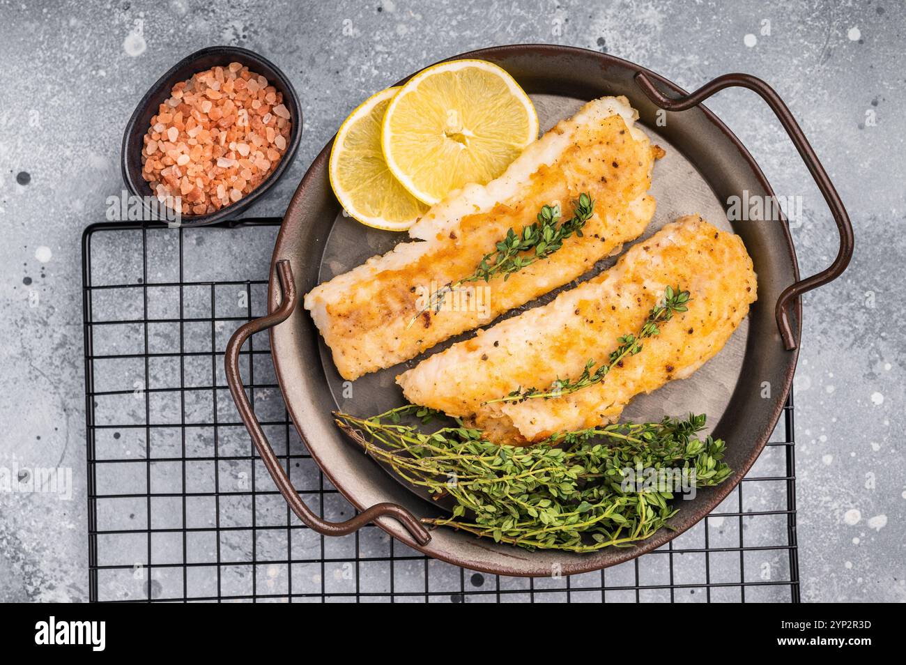 Baked Cod fish fiilet, fried whitefish meat. Grey background. top view ...