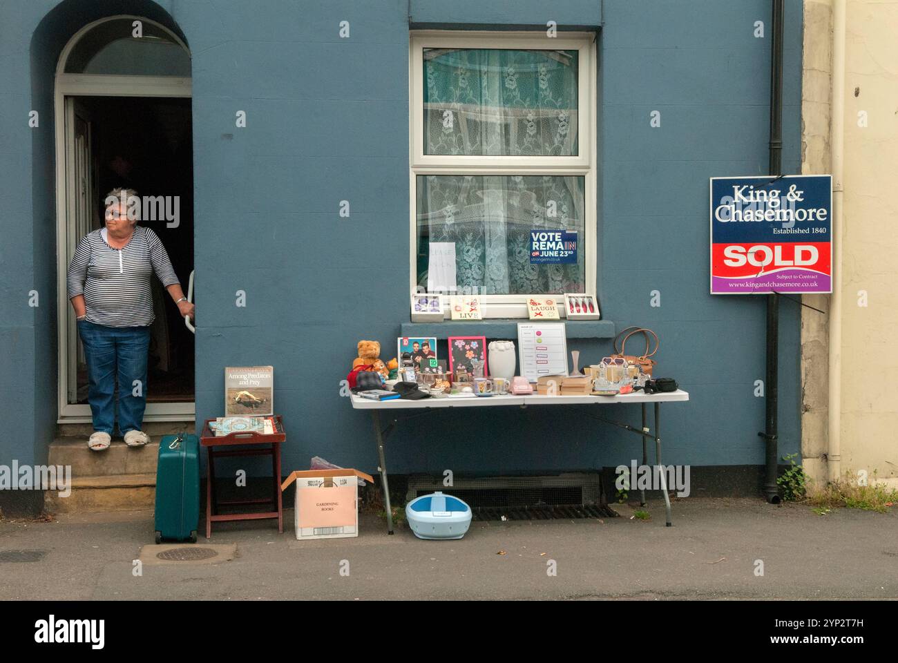 Woman clearing out house hi-res stock photography and images - Alamy