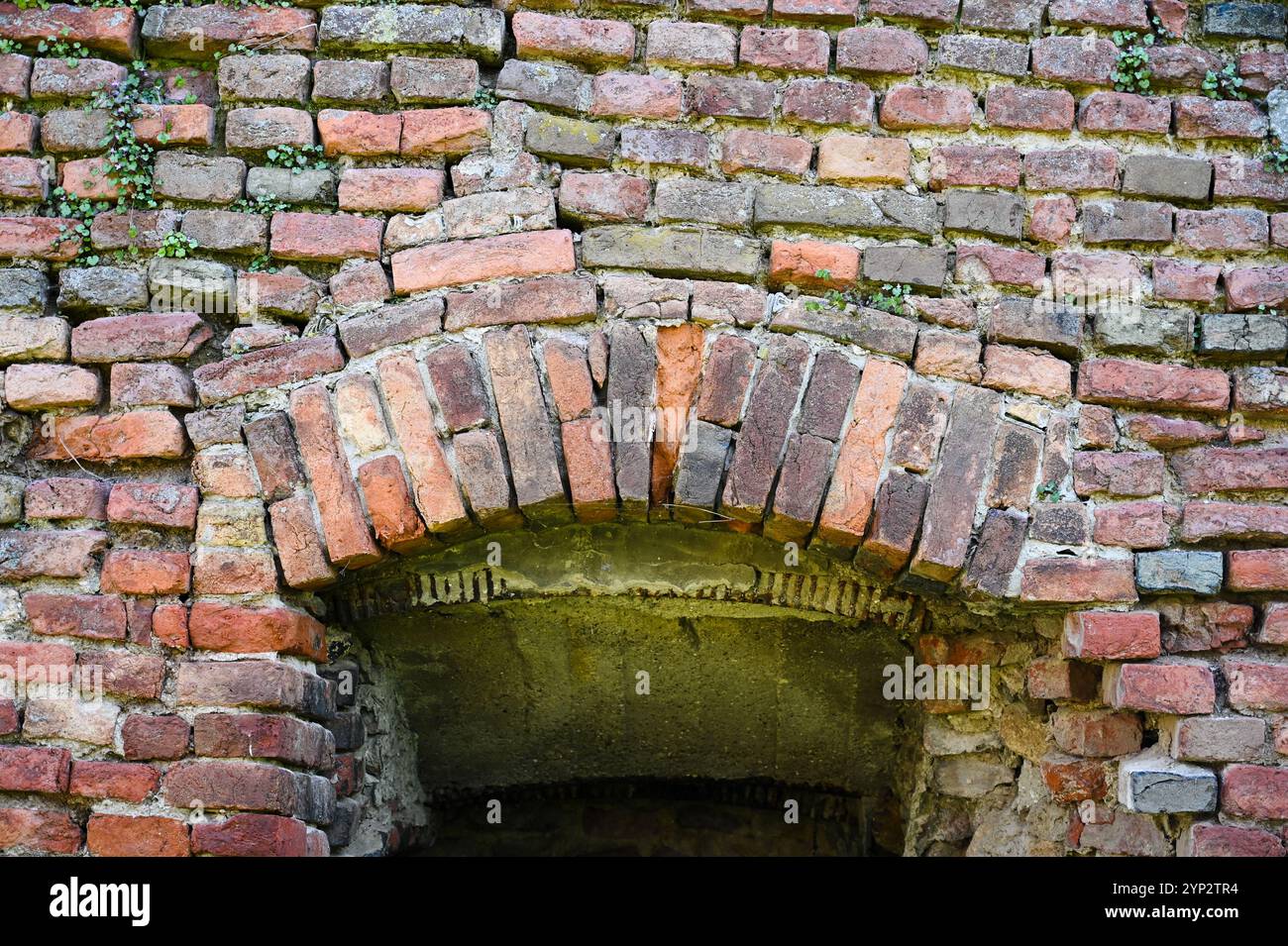 window opening in the ancient brick wall of the fortress. close-up ...