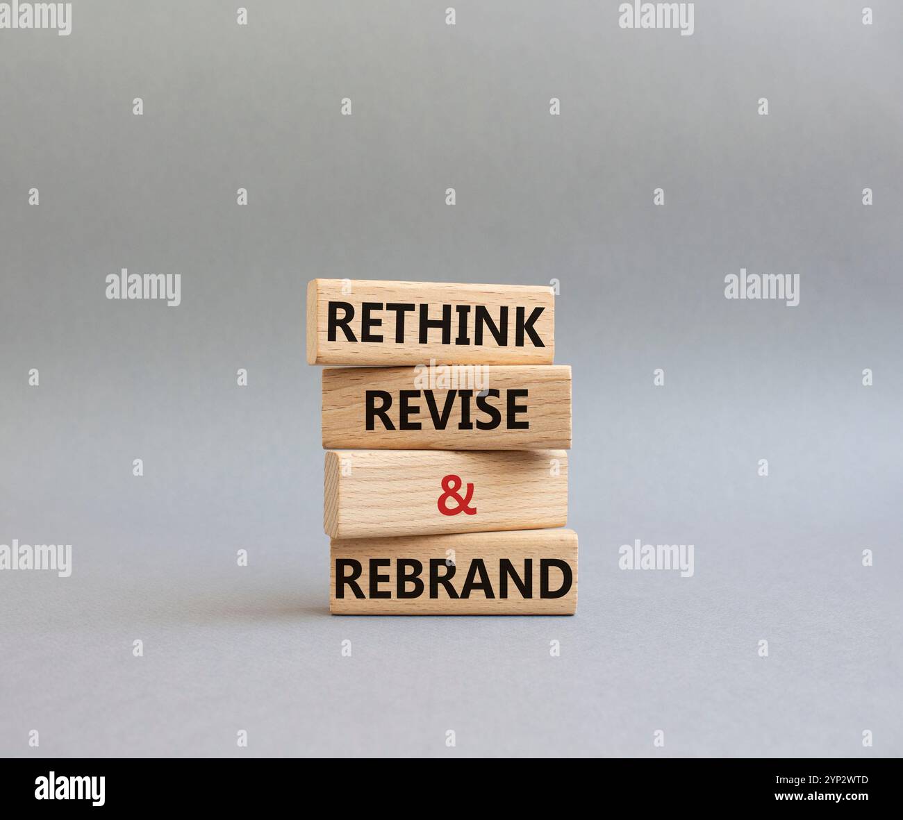 Rethink Revise and Rebrand symbol. Wooden blocks with words Rethink Revise and Rebrand ...