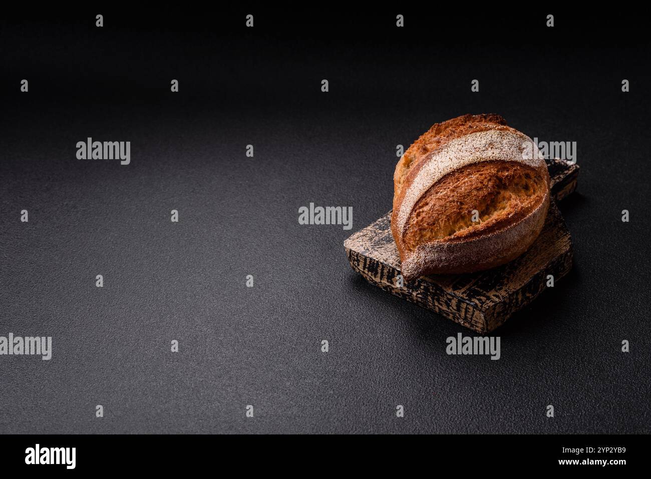 Homemade fresh crispy wholemeal bread on dark concrete background Stock ...
