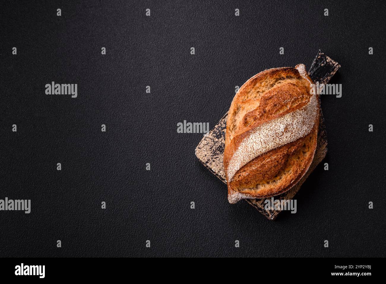 Homemade fresh crispy wholemeal bread on dark concrete background Stock ...
