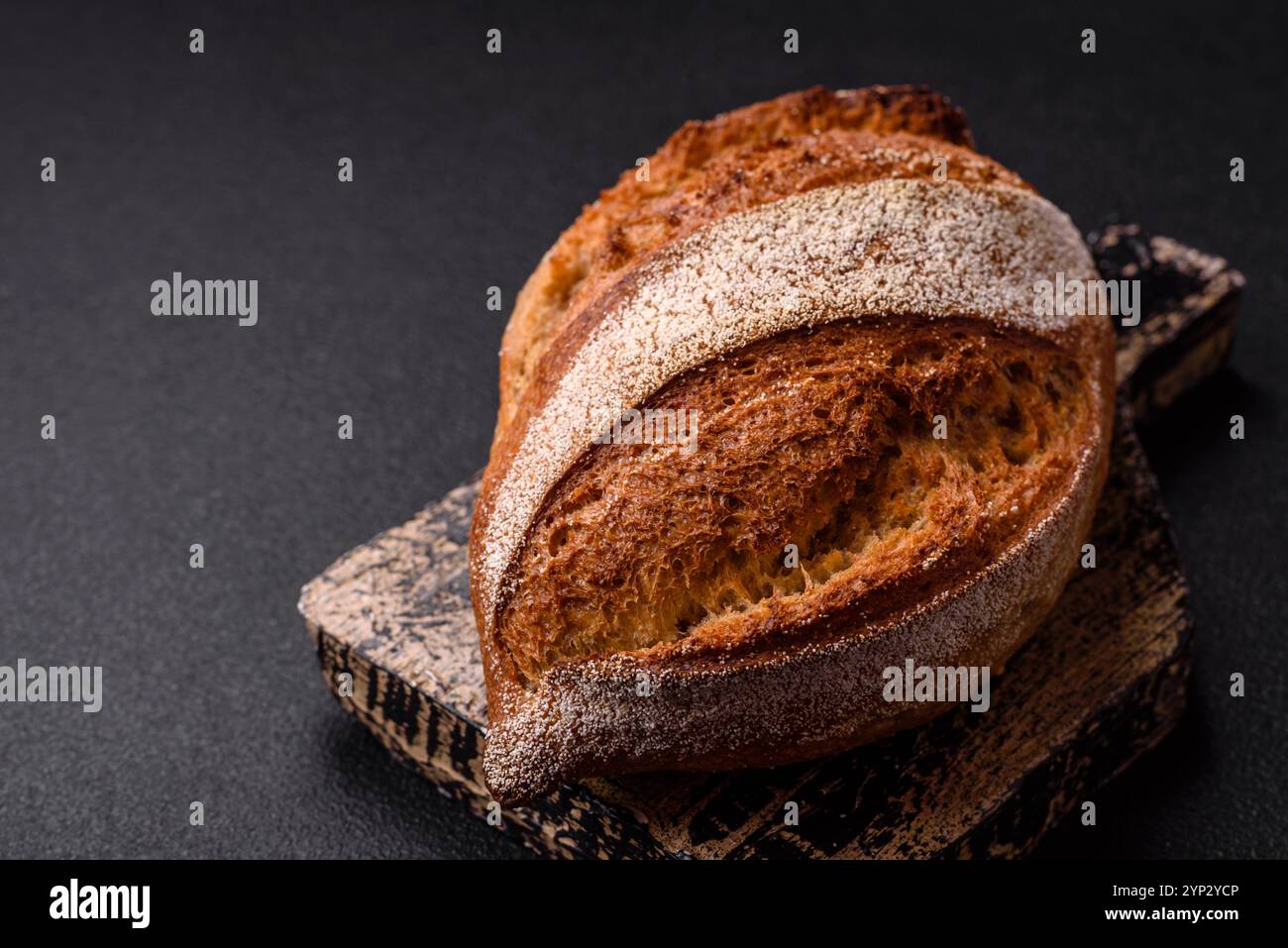 Homemade fresh crispy wholemeal bread on dark concrete background Stock ...