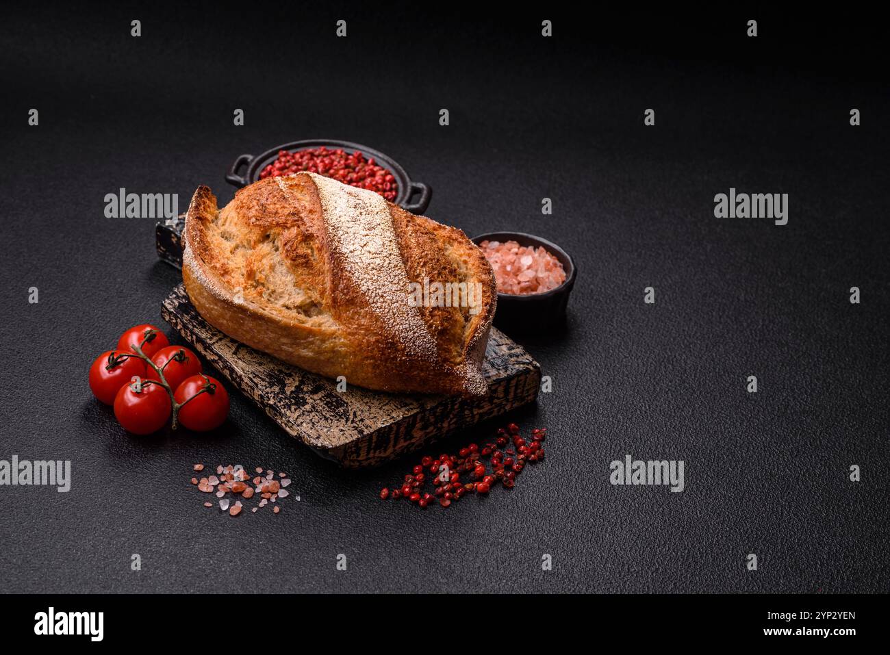 Homemade fresh crispy wholemeal bread on dark concrete background Stock ...