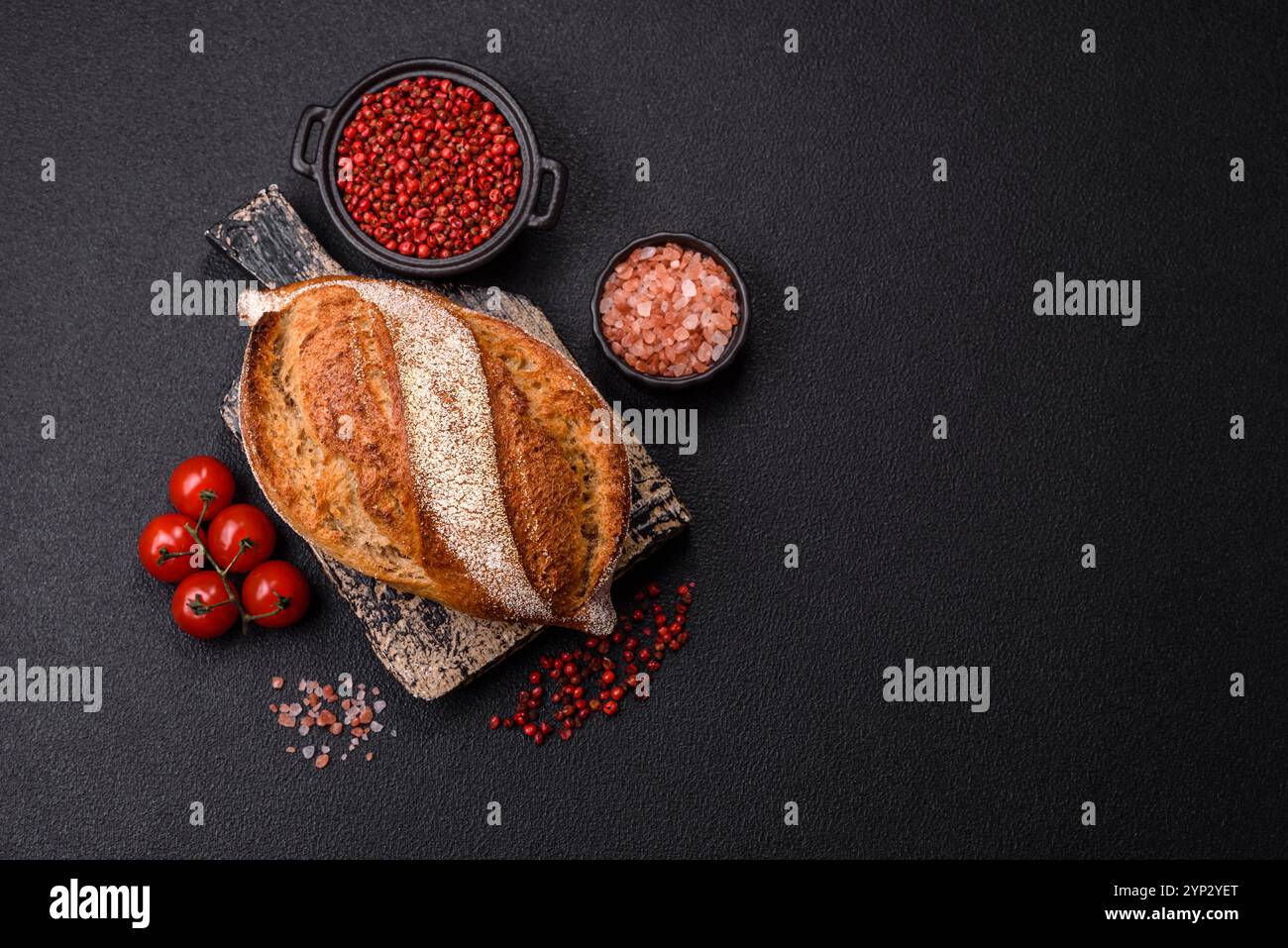 Homemade fresh crispy wholemeal bread on dark concrete background Stock ...