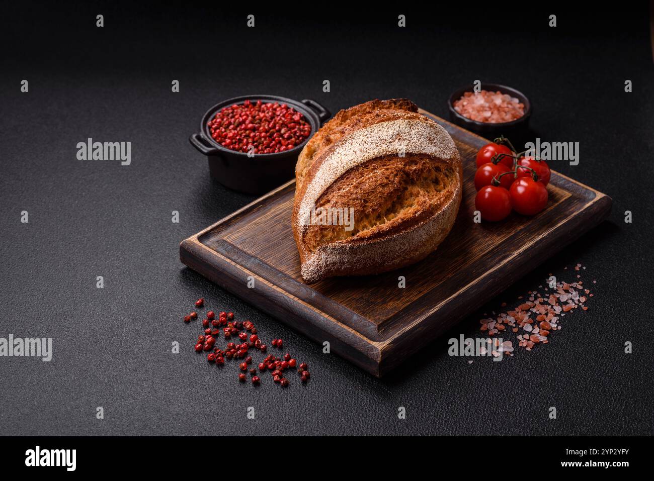 Homemade fresh crispy wholemeal bread on dark concrete background Stock ...