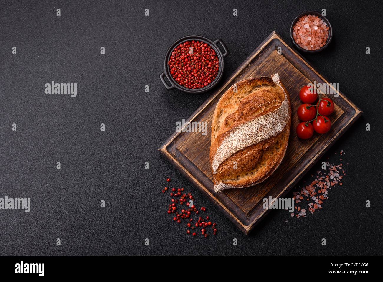 Homemade fresh crispy wholemeal bread on dark concrete background Stock ...