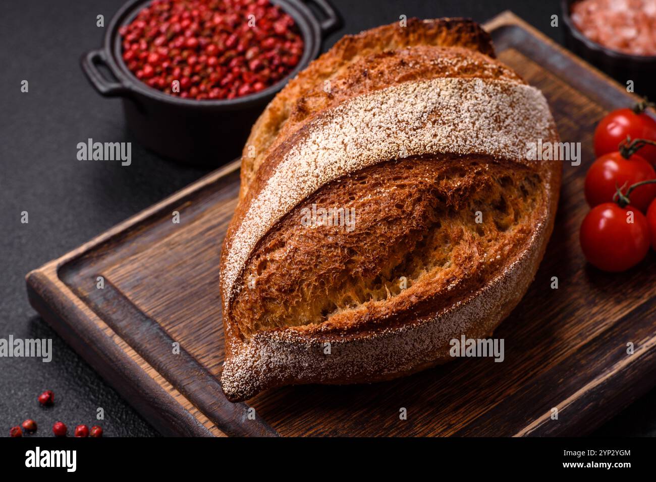 Homemade fresh crispy wholemeal bread on dark concrete background Stock ...