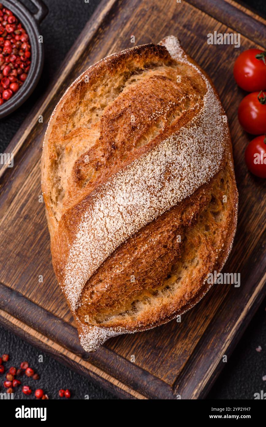 Homemade fresh crispy wholemeal bread on dark concrete background Stock ...