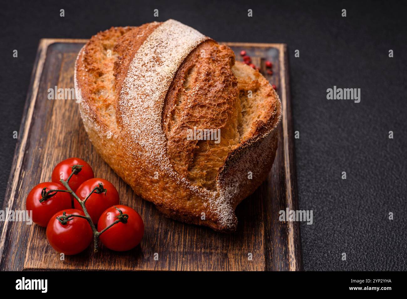 Homemade fresh crispy wholemeal bread on dark concrete background Stock ...