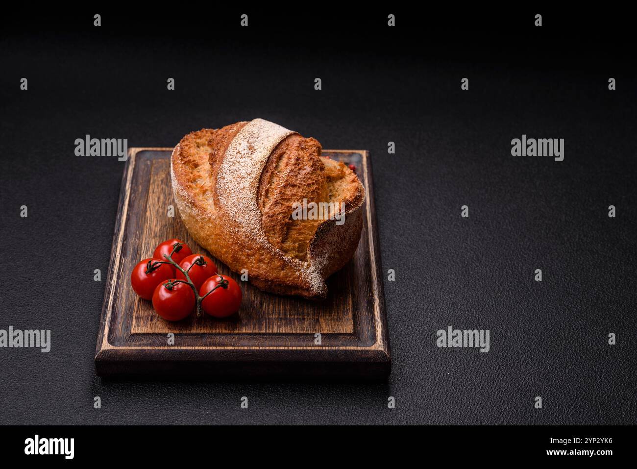 Homemade fresh crispy wholemeal bread on dark concrete background Stock ...