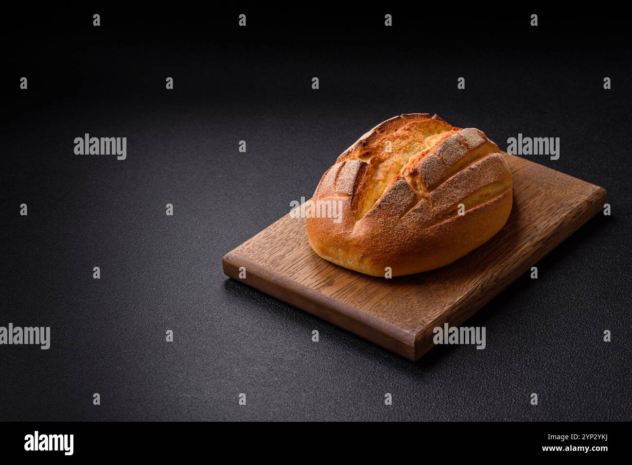 Homemade fresh crispy wholemeal bread on dark concrete background Stock ...