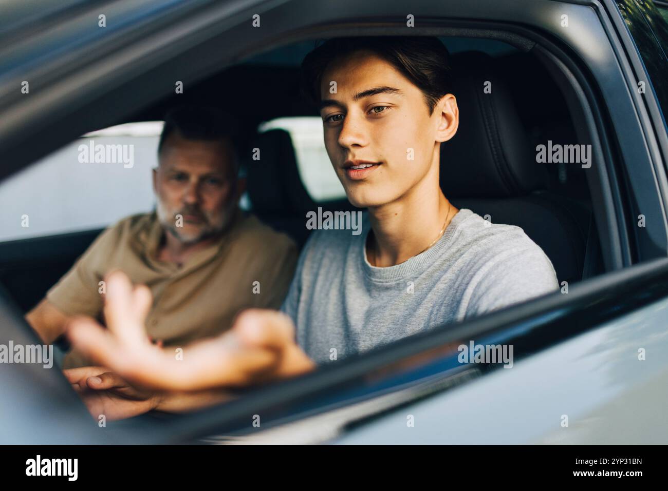 Father driving young son in hi-res stock photography and images - Alamy