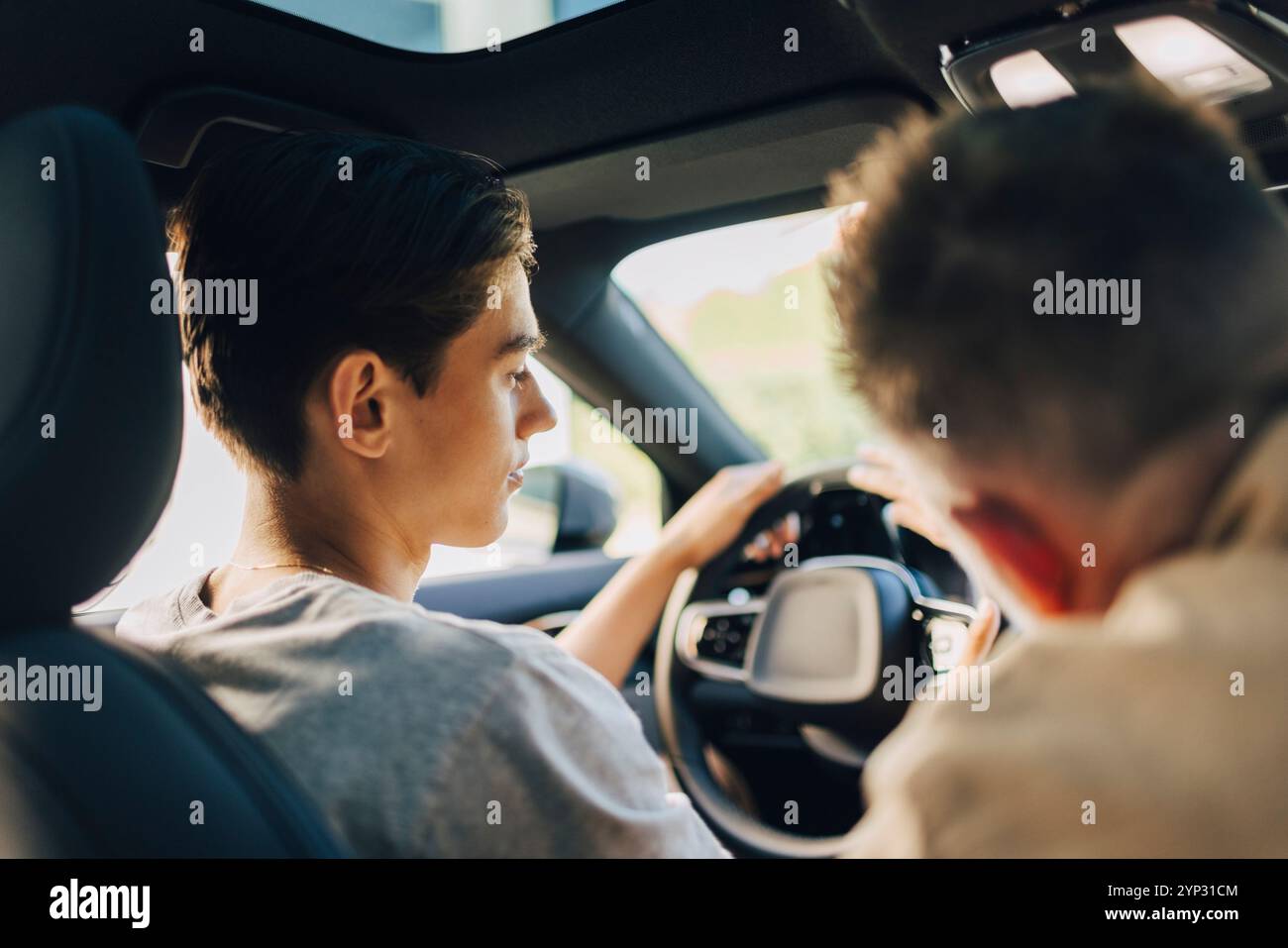 Father driving young son in hi-res stock photography and images - Alamy