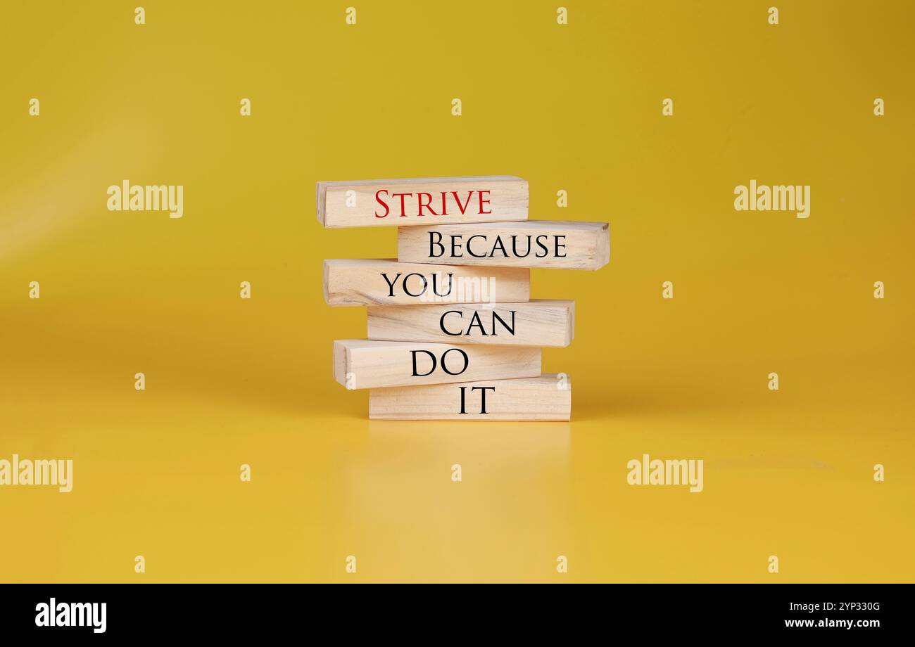 Strive because you can do it symbol written on Wooden blocks with words ...