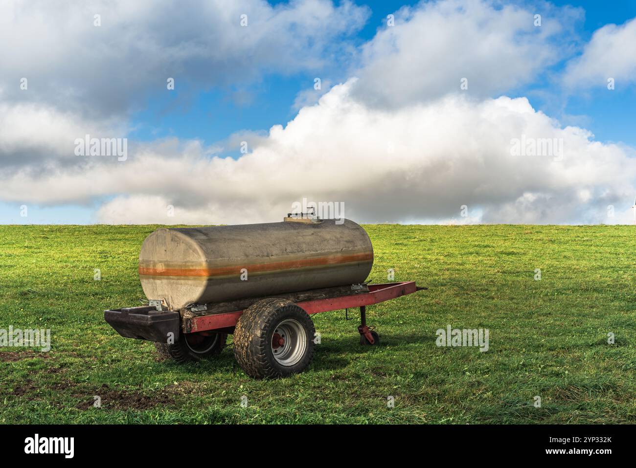 Water tank for cattle on a trailer in a field, St. Peter, Baden ...